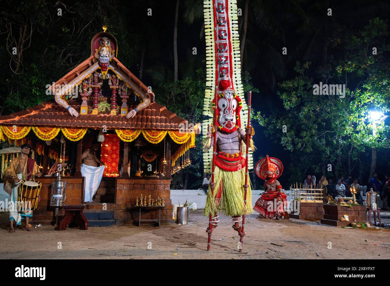 India, Kerala, Kannur, Theyyam ceremony. Beautifully dressed and with ...