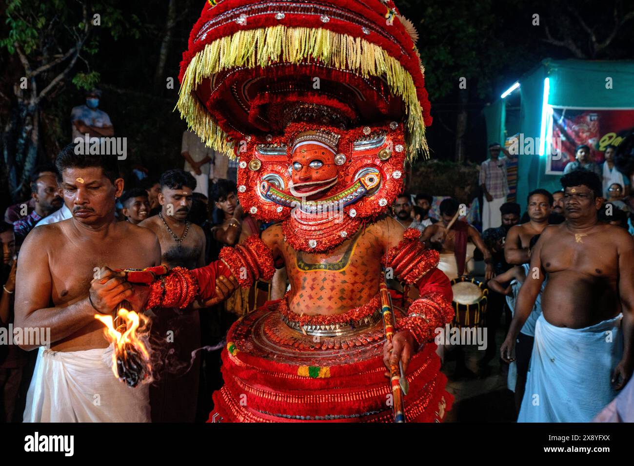 India, Kerala, Kannur, Theyyam ceremony. Beautifully dressed and with ...