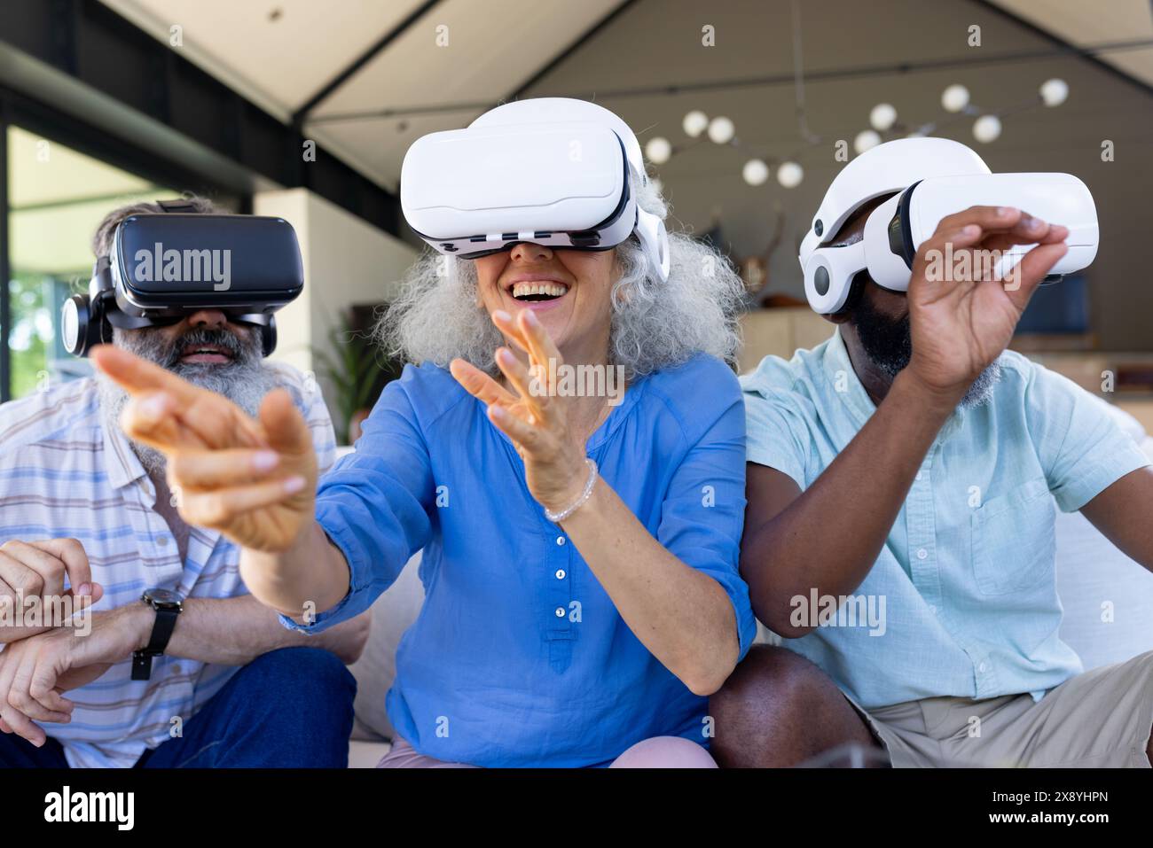 At home, diverse senior friends enjoying virtual reality together Stock ...
