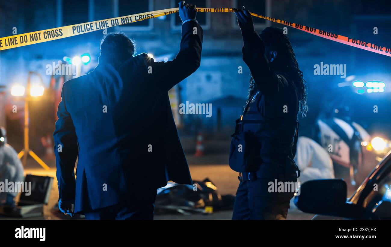 Team of Two Multiethnic Police Officers Working on Profiling a Killer ...