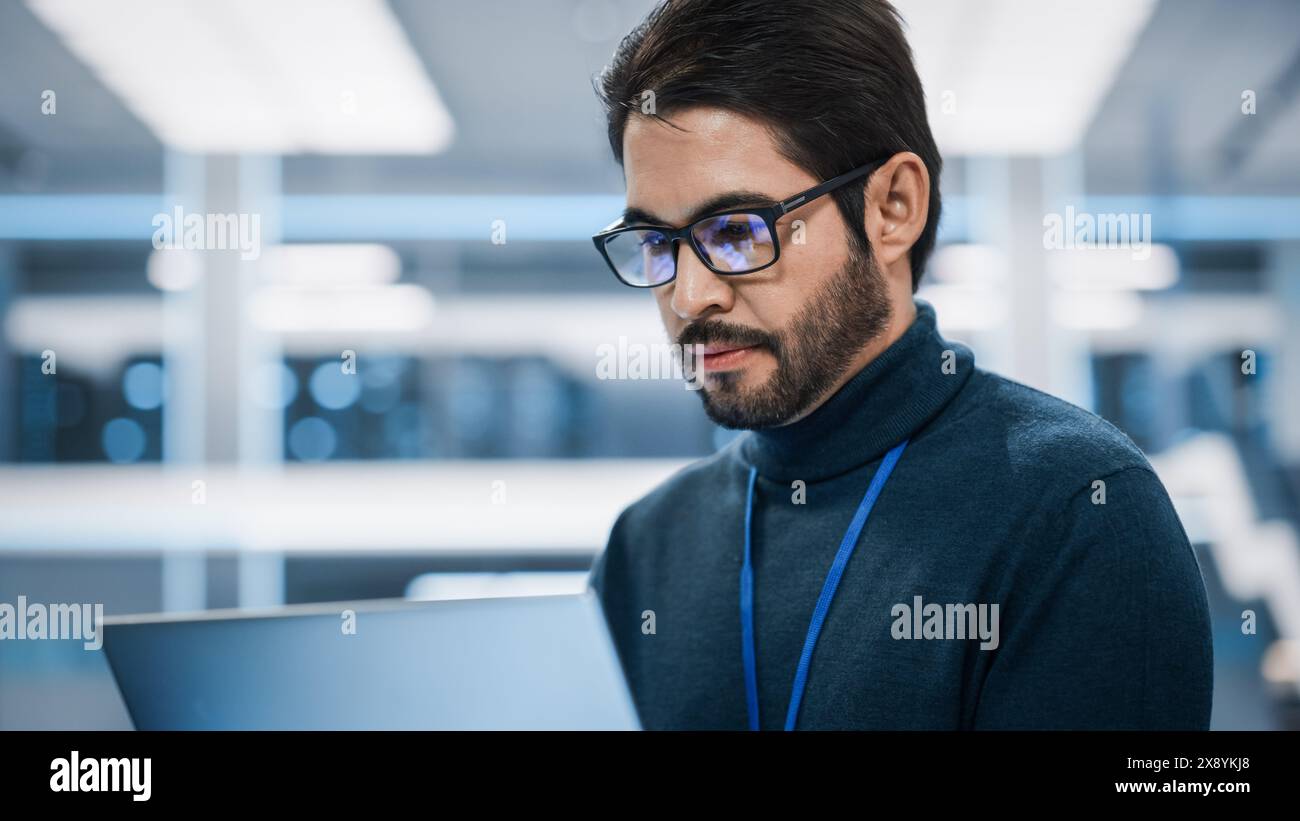 Portrait of a Professional Hispanic Man Using Laptop at Work in ...