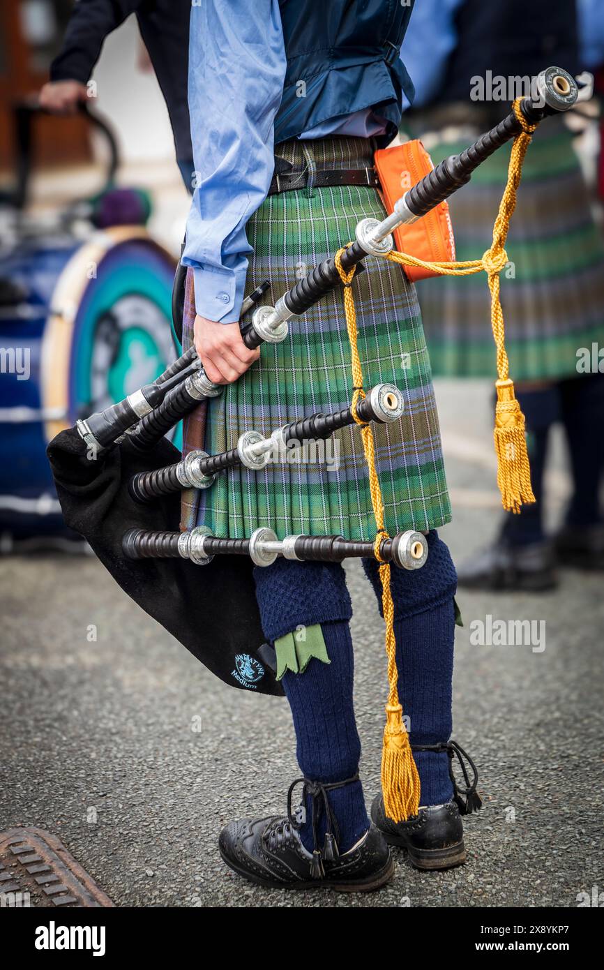 United Kingdom, Scotland, Highlands, Portree, young bagpipe musician of ...