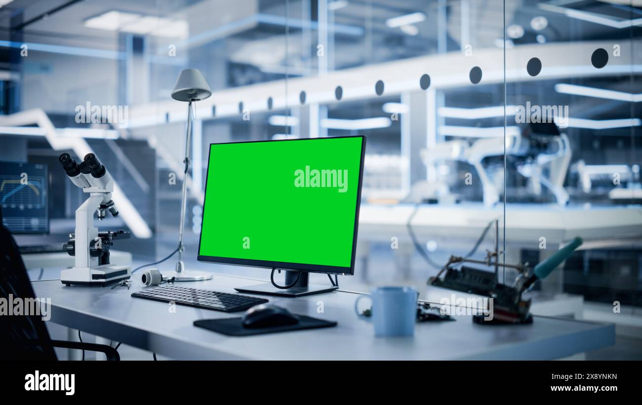 Modern Industrial Research Laboratory with Desktop Computer with Green Screen Mock Up Display ...