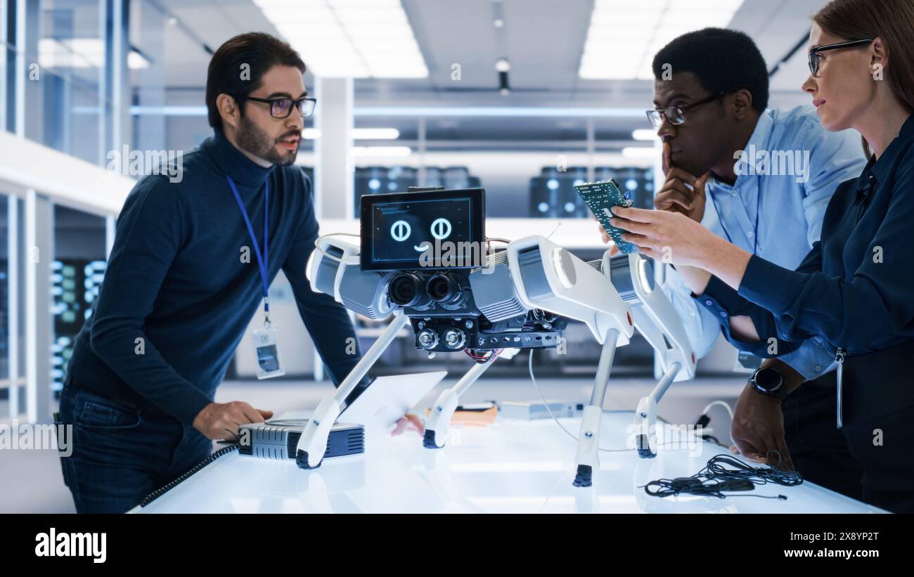 Multicultural Team of Industrial Robotics Engineers Gathered Around a ...