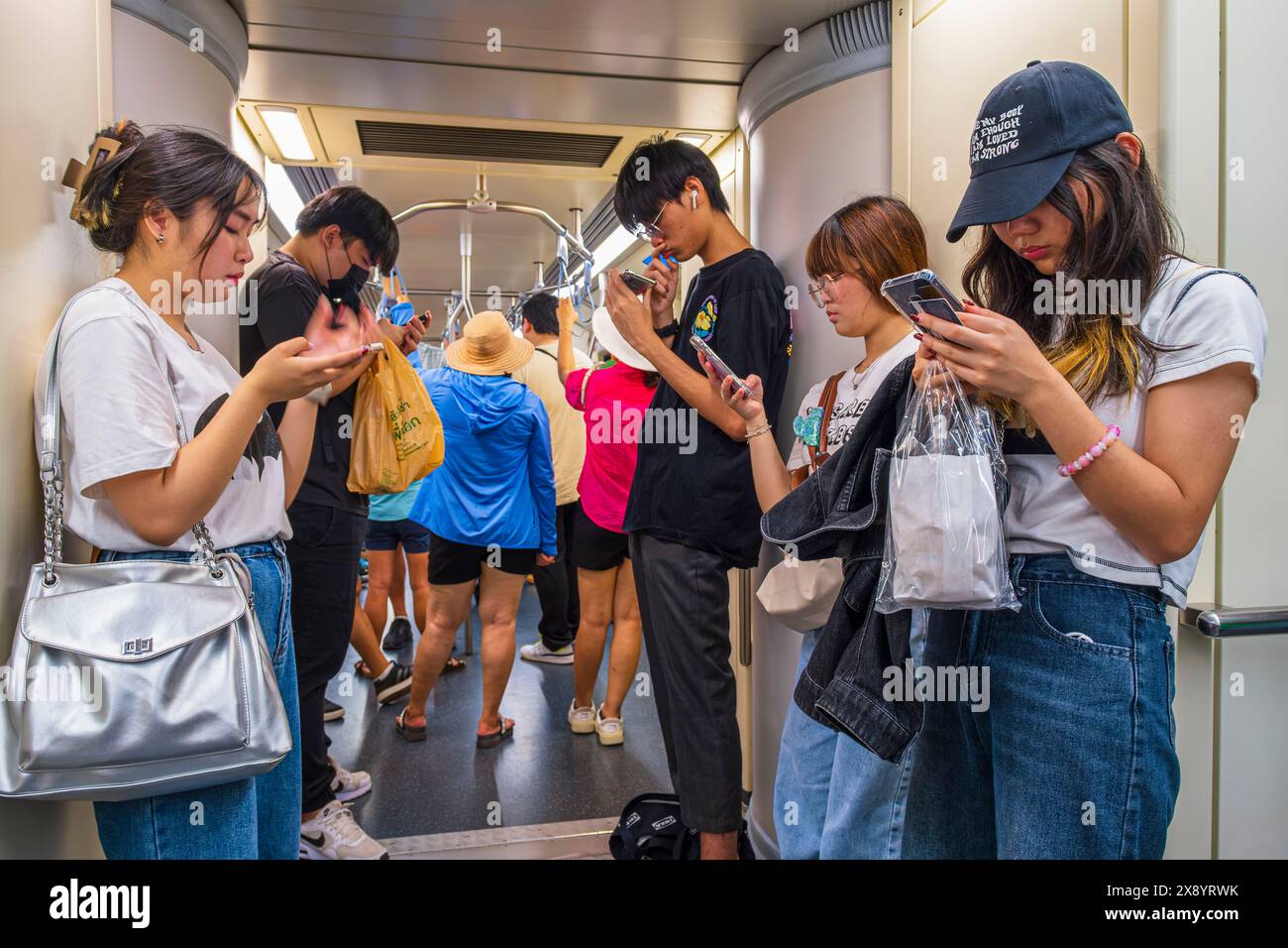 Thailand, Bangkok, young passengers on MRT (Mass Rapid Transit), public ...