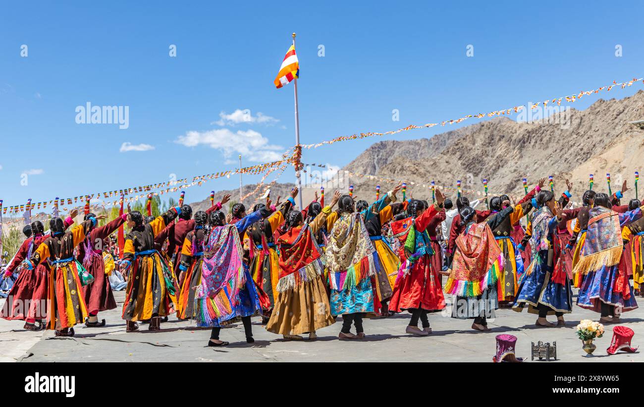 A group of young Buddhist girls performing traditional dance sequence ...