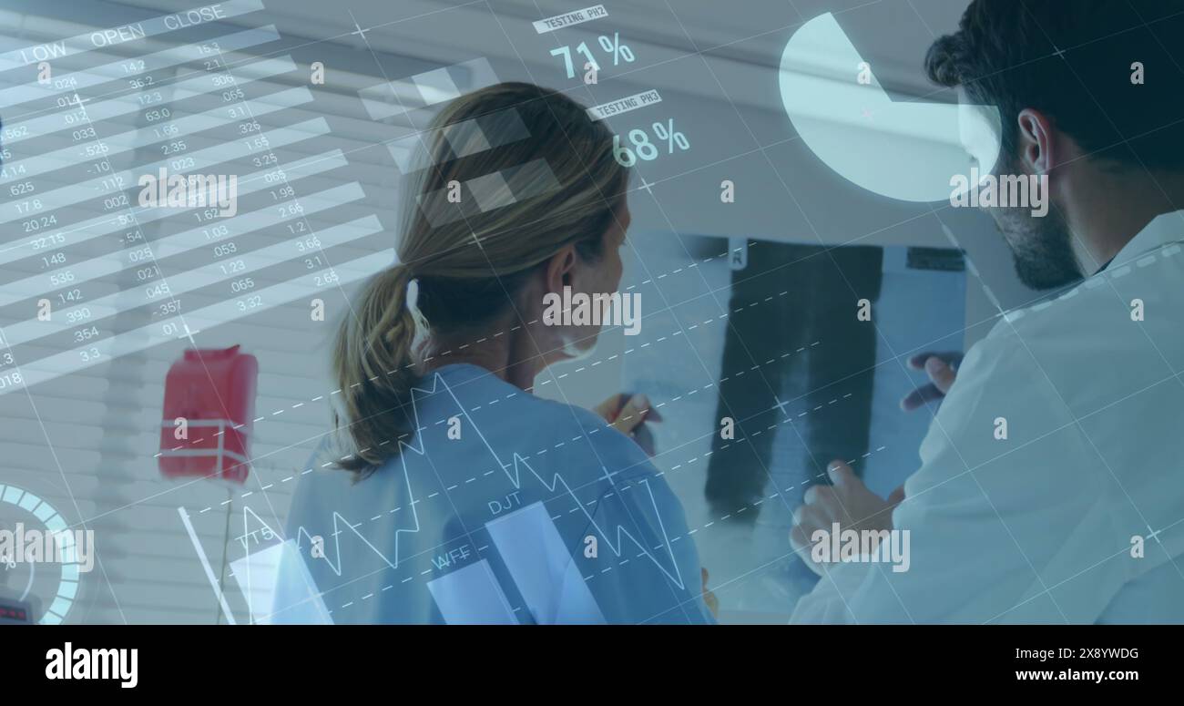 Diverse medical team analyzing patient hi-res stock photography and ...