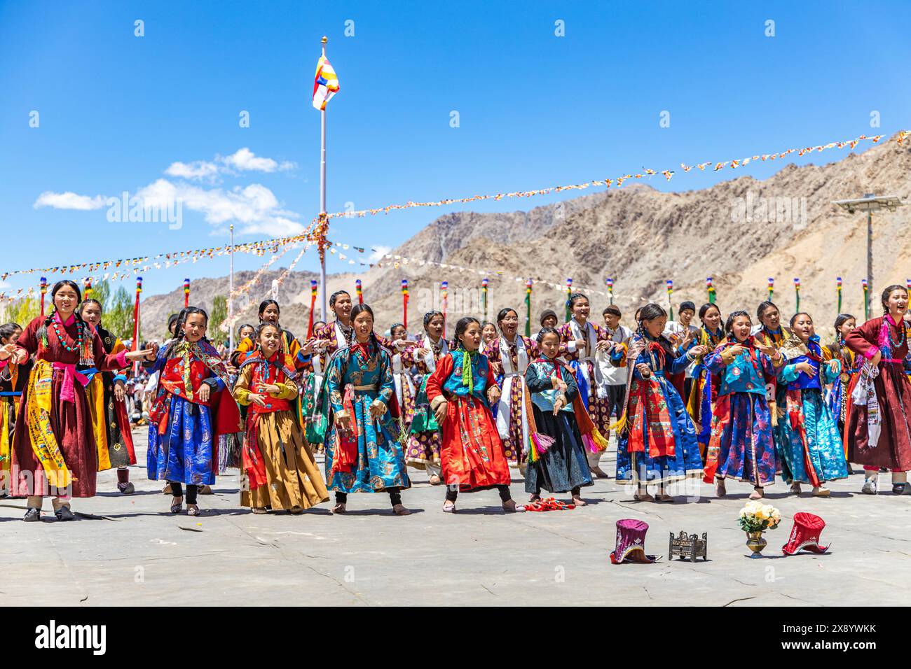 A group of young Buddhist girls performing traditional dance sequence ...