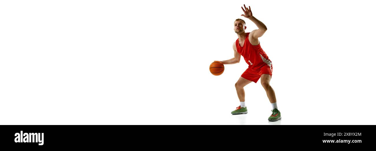 Banner. Young man, skilled basketball player dribbling against white ...
