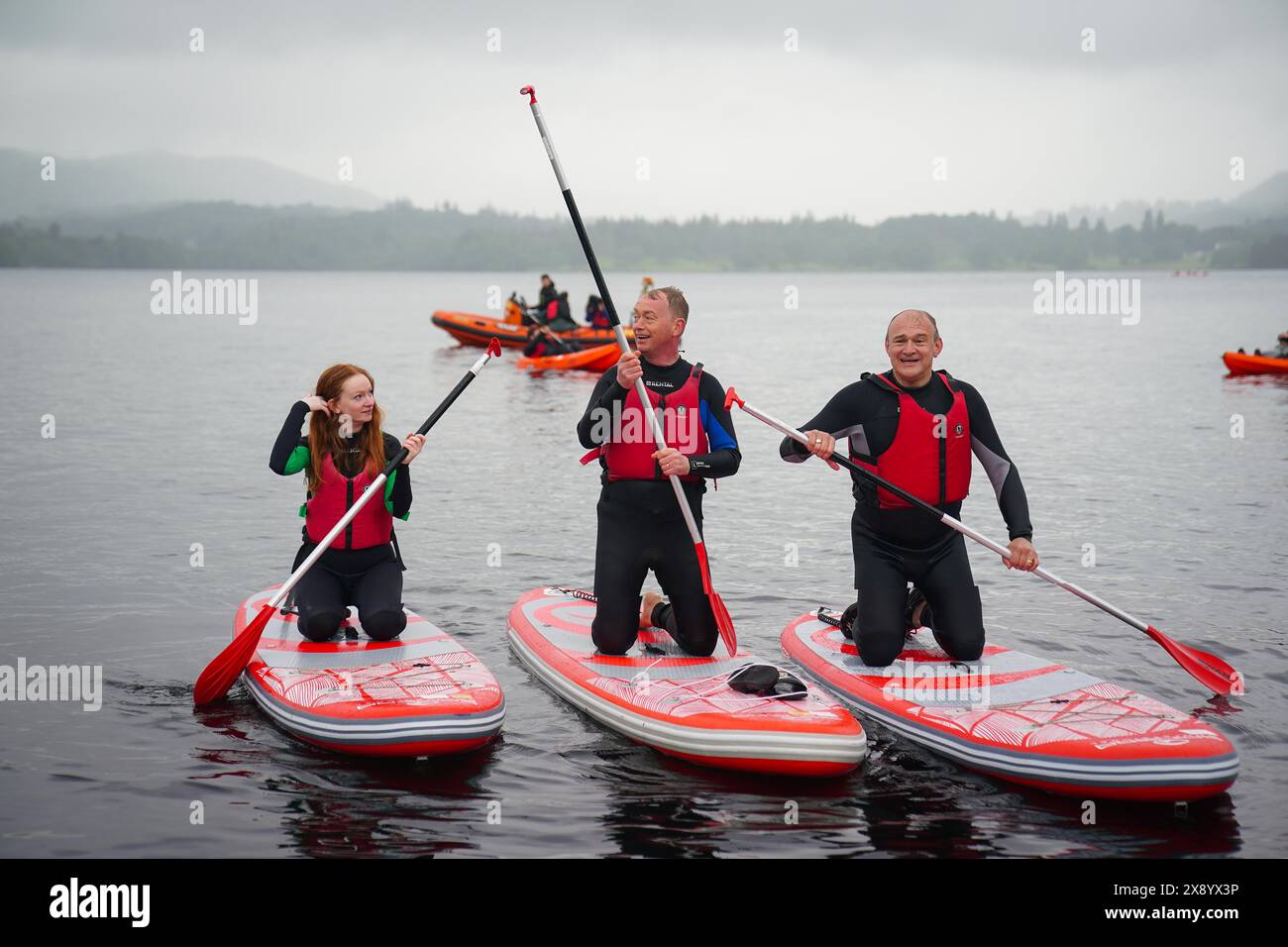 Liberal Democrat Leader Sir Ed Davey (right) paddleboarding with local ...