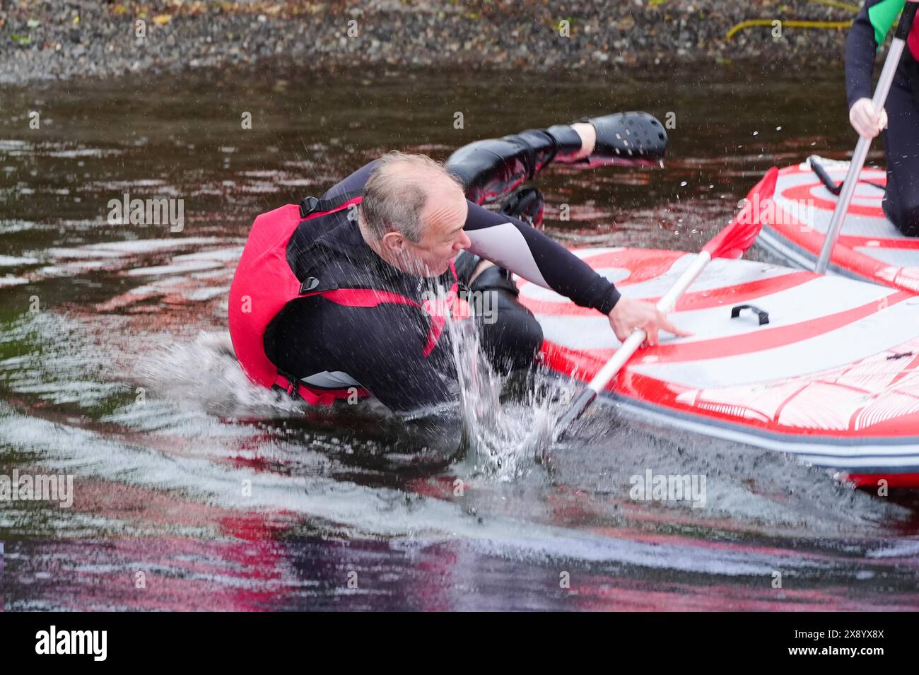 Liberal Democrat Leader Sir Ed Davey falls into the water while ...