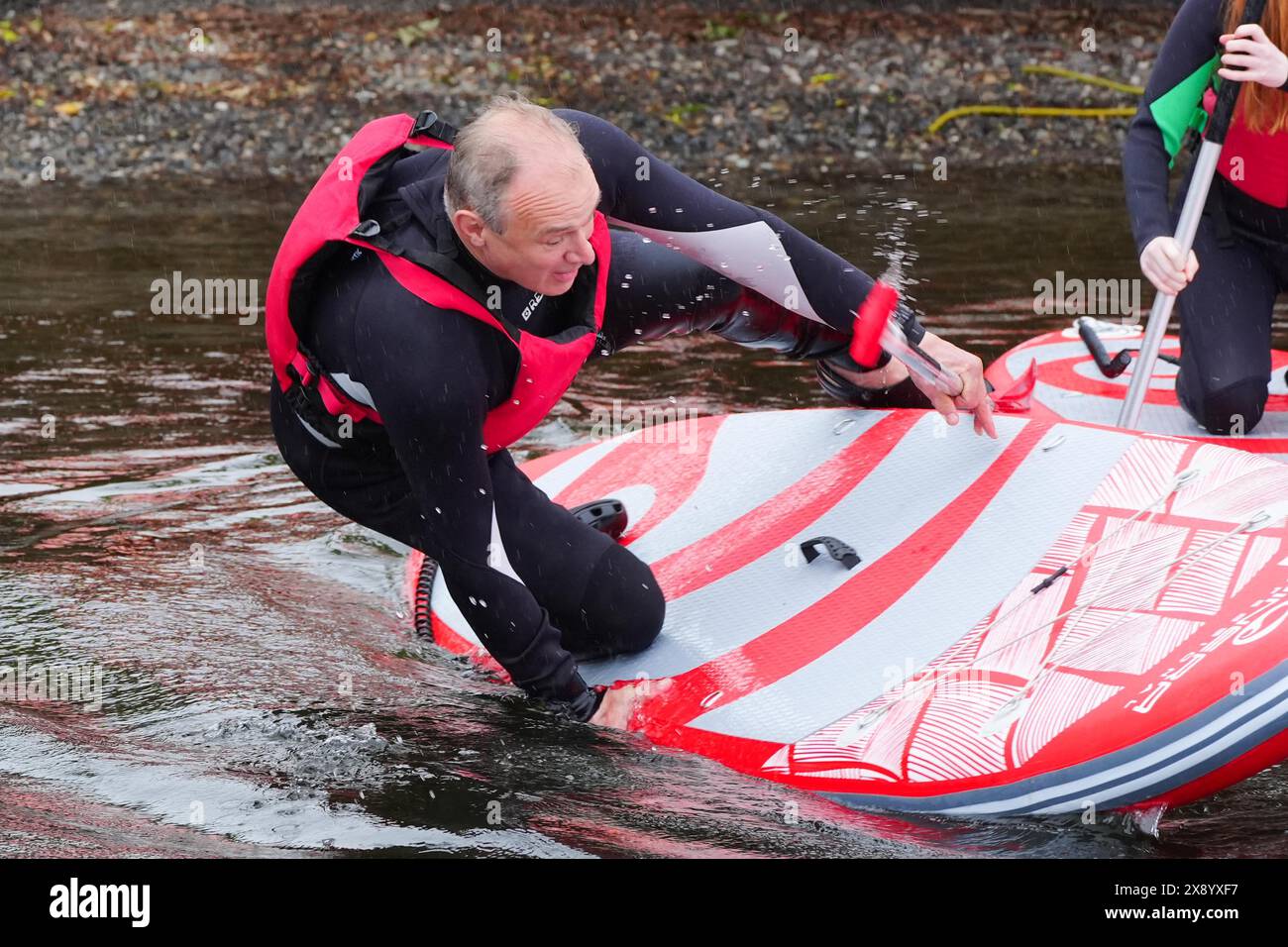 Liberal Democrat Leader Sir Ed Davey falls into the water while ...