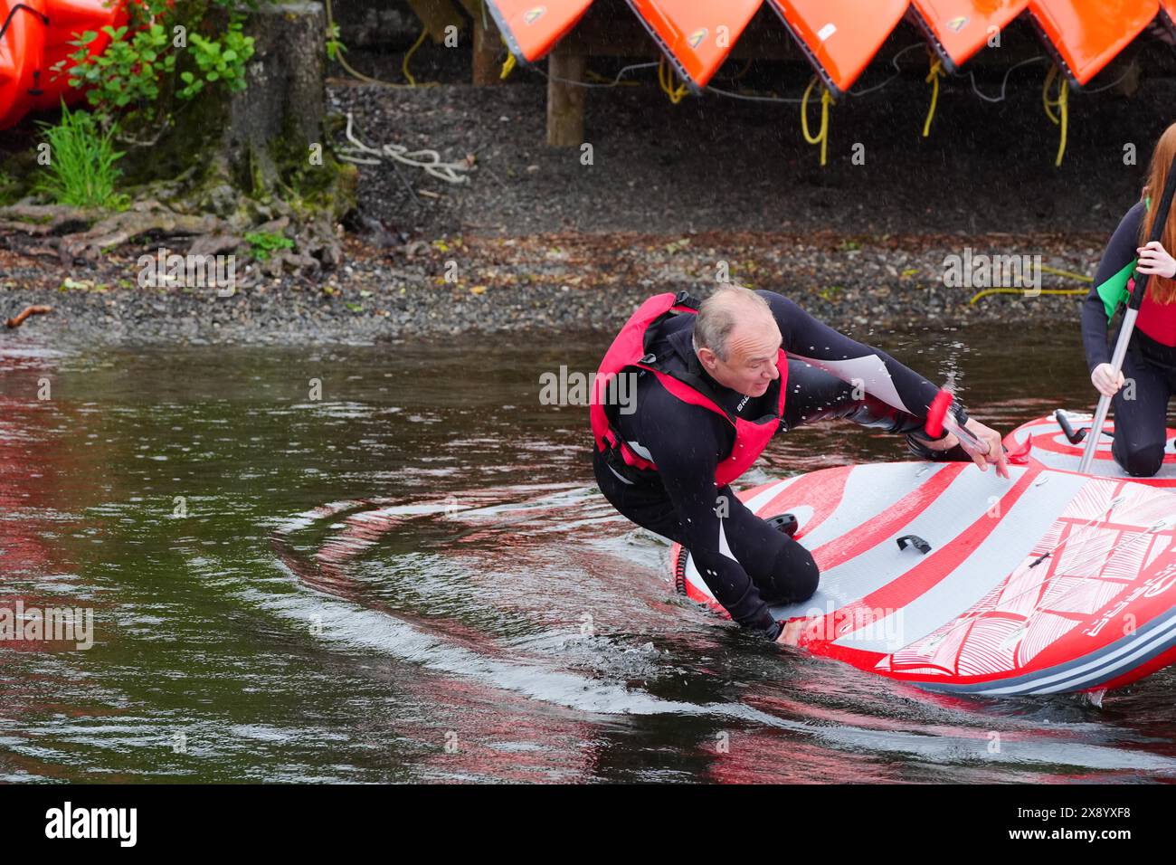 Liberal Democrat Leader Sir Ed Davey falls into the water while ...