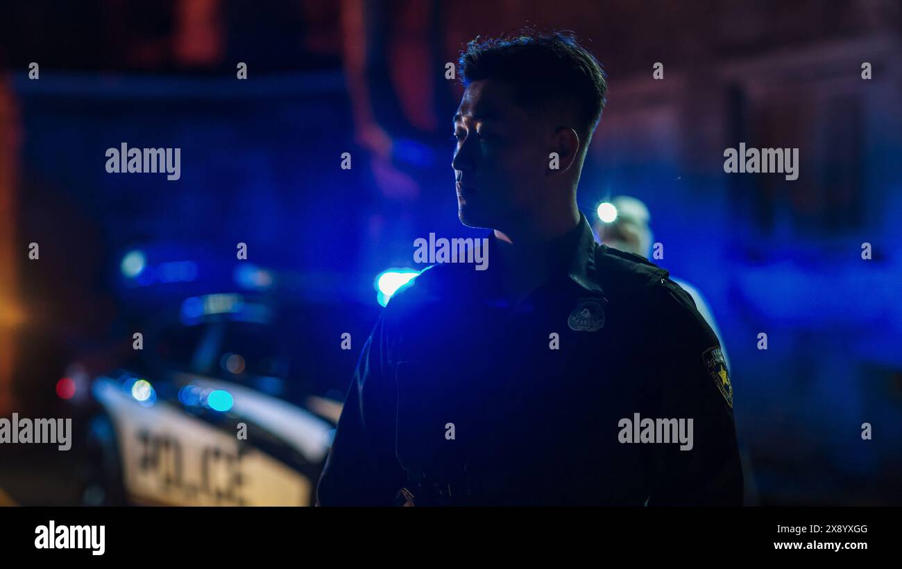 Close Up Shot Portrait Of A Young Asian Male Police Officer Looking