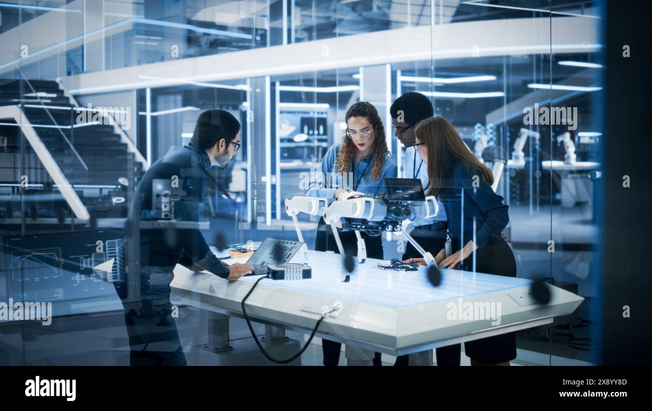 Diverse Colleagues Work in Industrial Robotics Factory, Experimenting ...