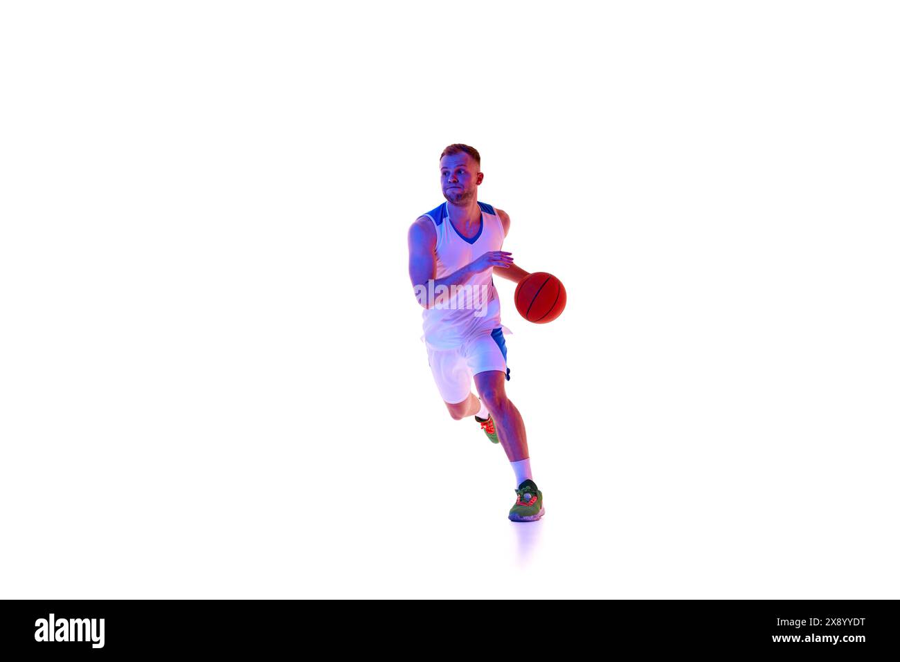 Basketball player in motion, running forward and training dribbling ...