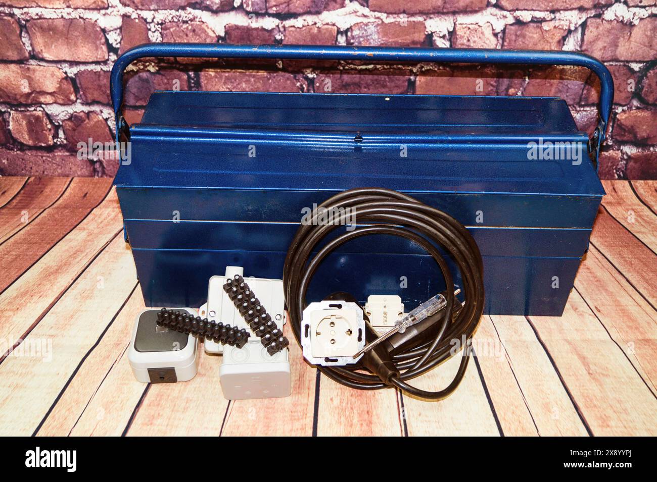 toolbox with switch, socket, light bulb and power cable, symbol image ...