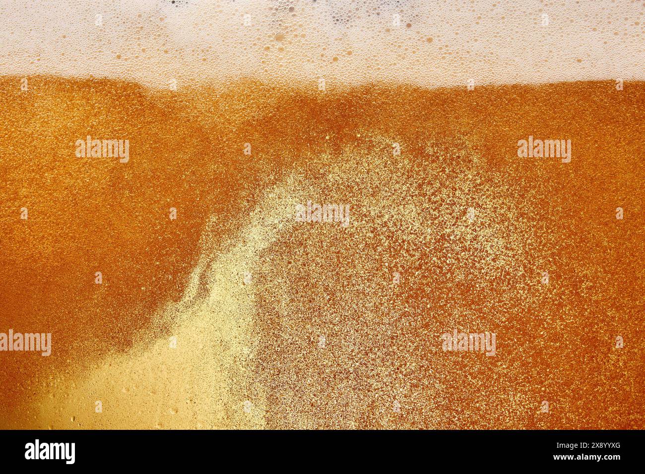 Delicious-looking beer poured into glass. Beer pale golden color and ...