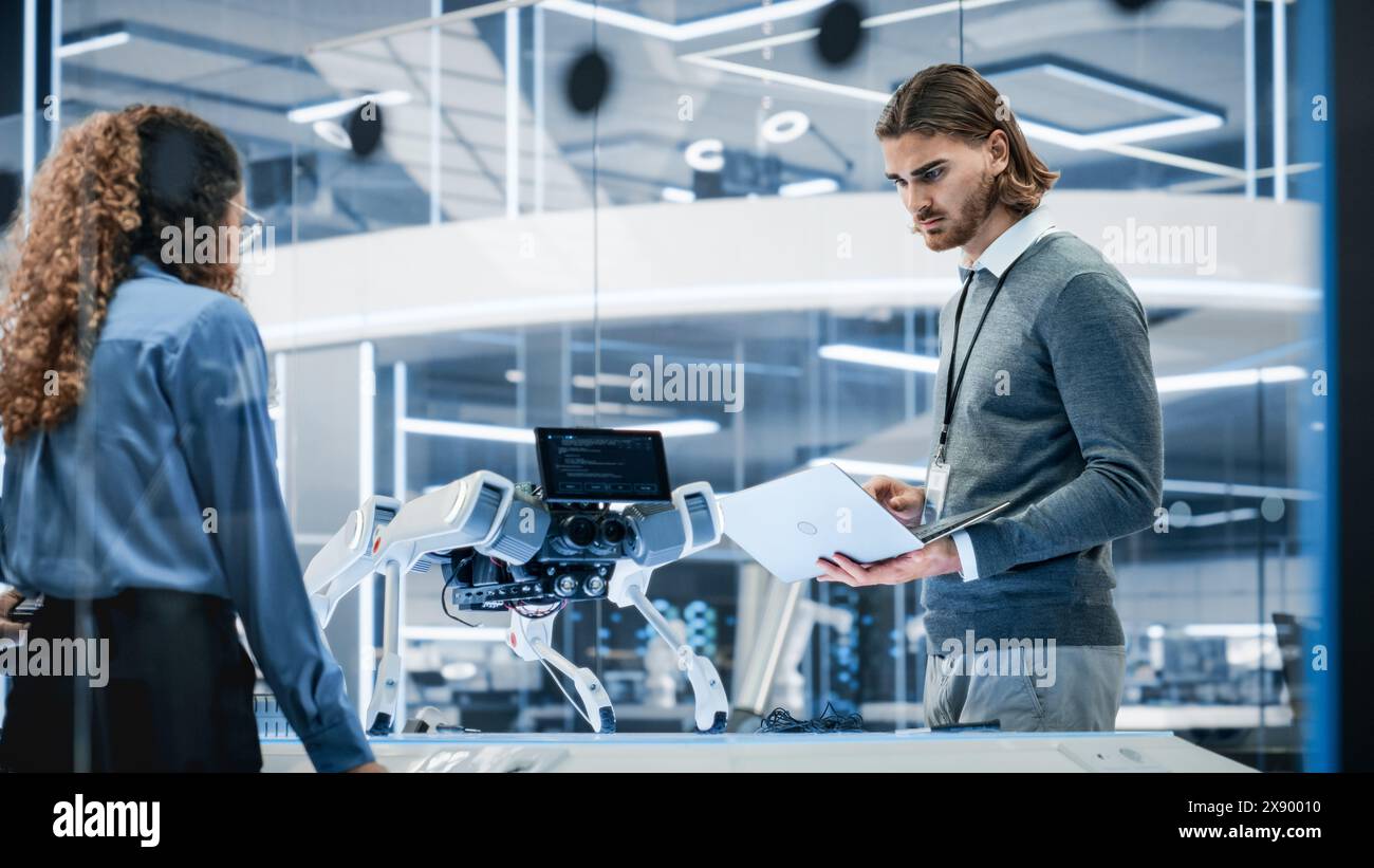 Young System Administrator Checking Online Internet Connectivity with a Prototype AI Robot ...