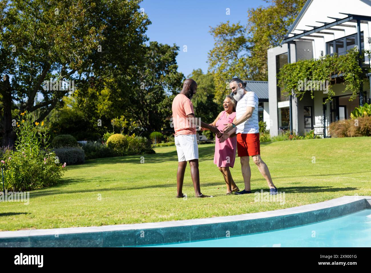 Outdoors, diverse senior friends laughing near pool Stock Photo - Alamy