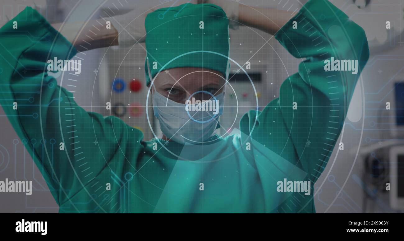 Image of round scanner against caucasian senior female surgeon wearing ...