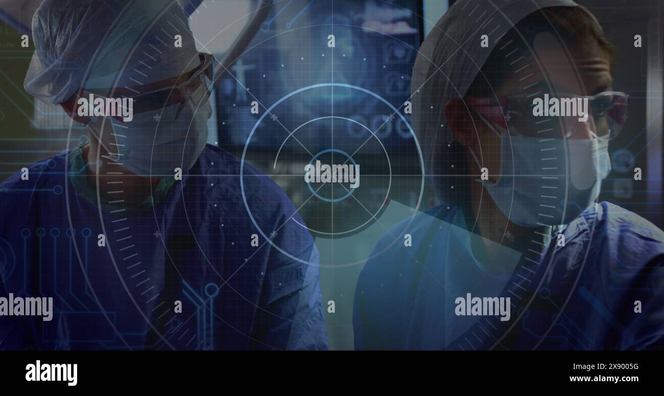 Image of round scanner against diverse male and female surgeons ...