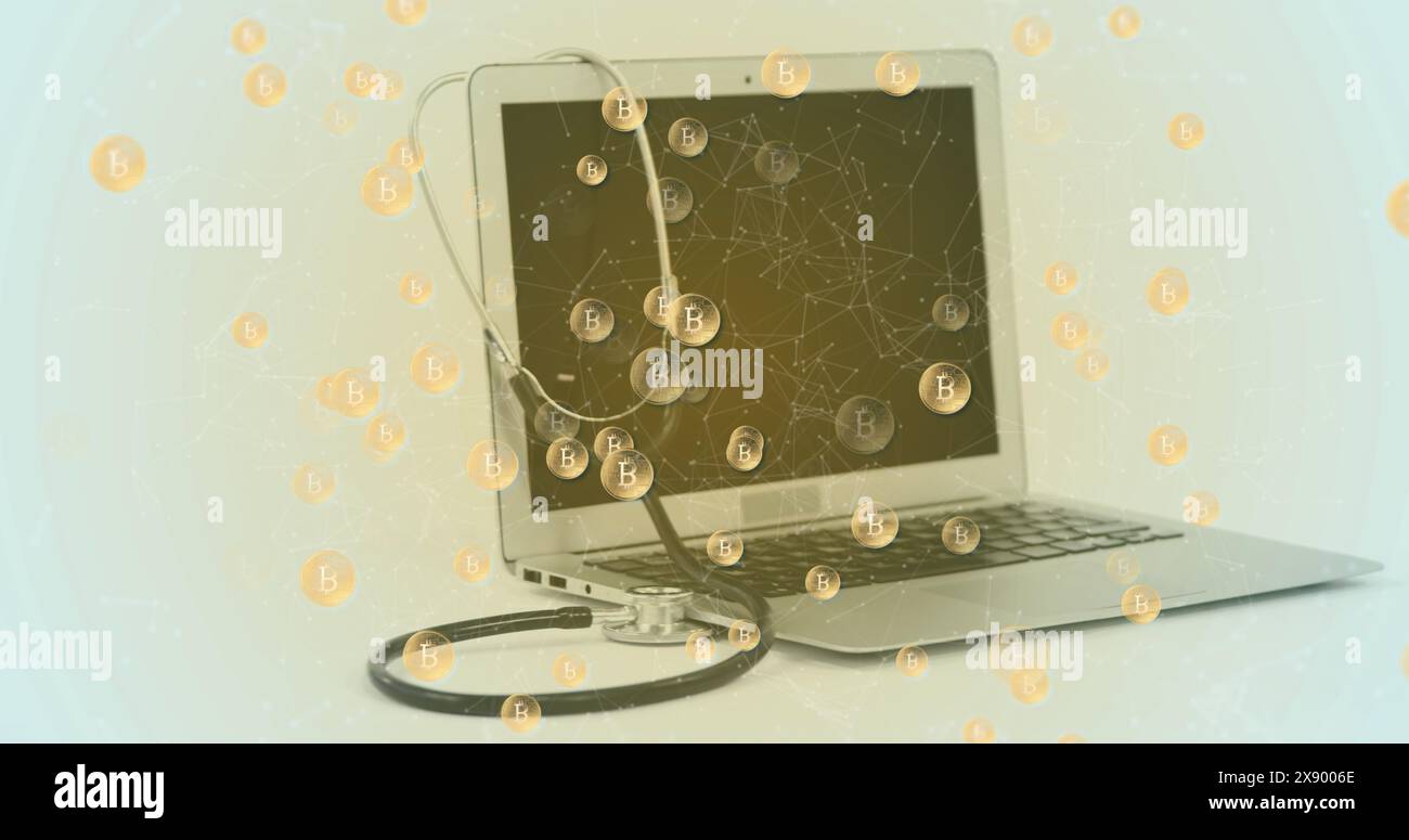 Image of bitcoin symbols against laptop and stethoscope against grey ...