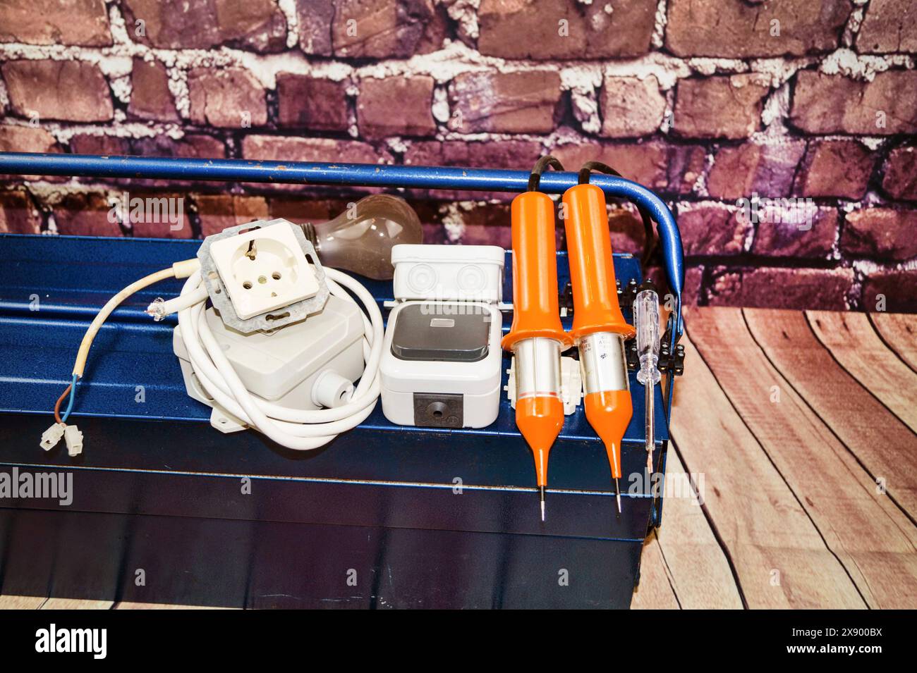 toolbox with switch, socket, light bulb, voltage tester and power cable ...