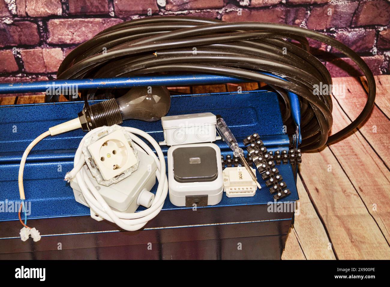 toolbox with switch, socket, light bulb and power cable, symbol image ...