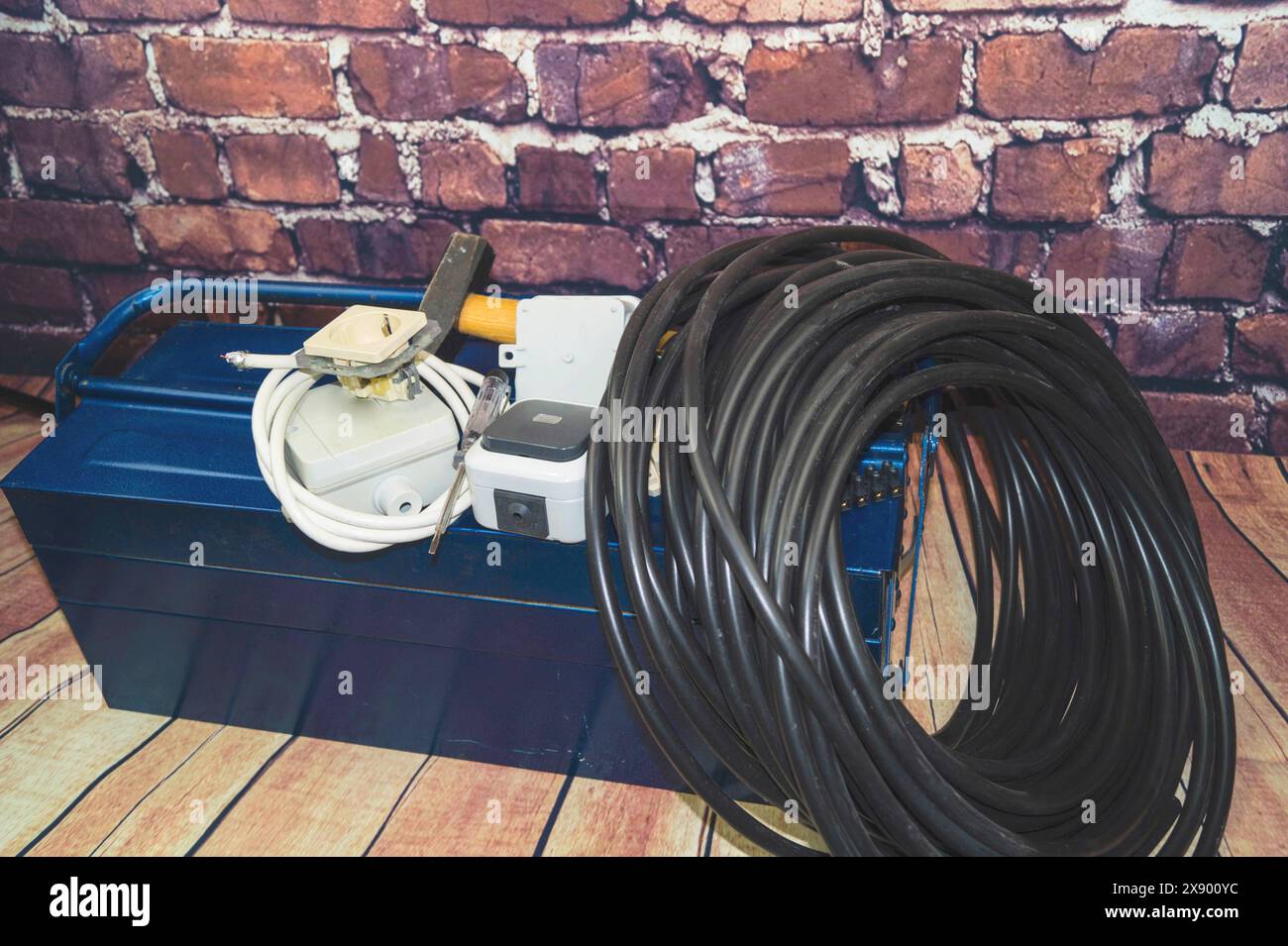 toolbox with switch, socket, light bulb and power cable, symbol image ...