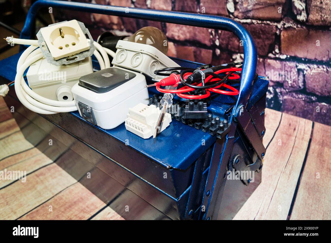 toolbox with switch, socket, light bulb, voltage tester and power cable ...