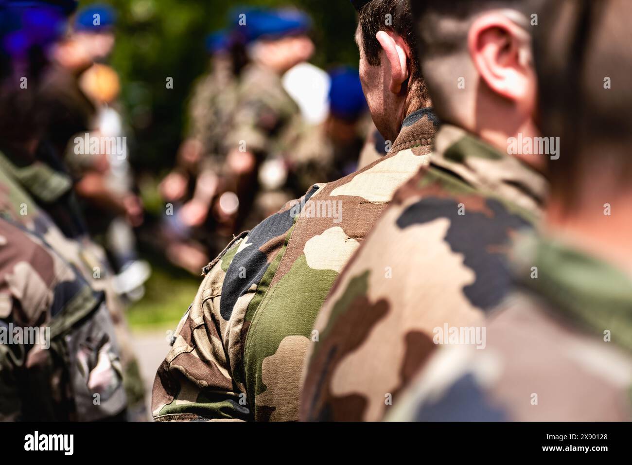 French soldier wearing camouflage uniform, close-up on his back with ...