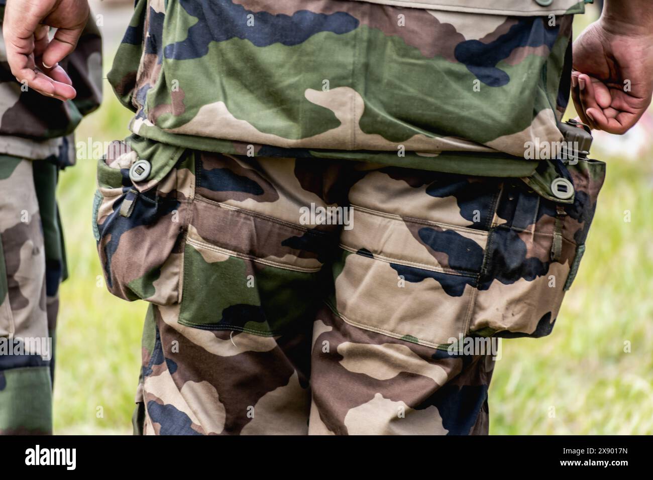 French soldier seen from behind with his equipment and camouflage ...