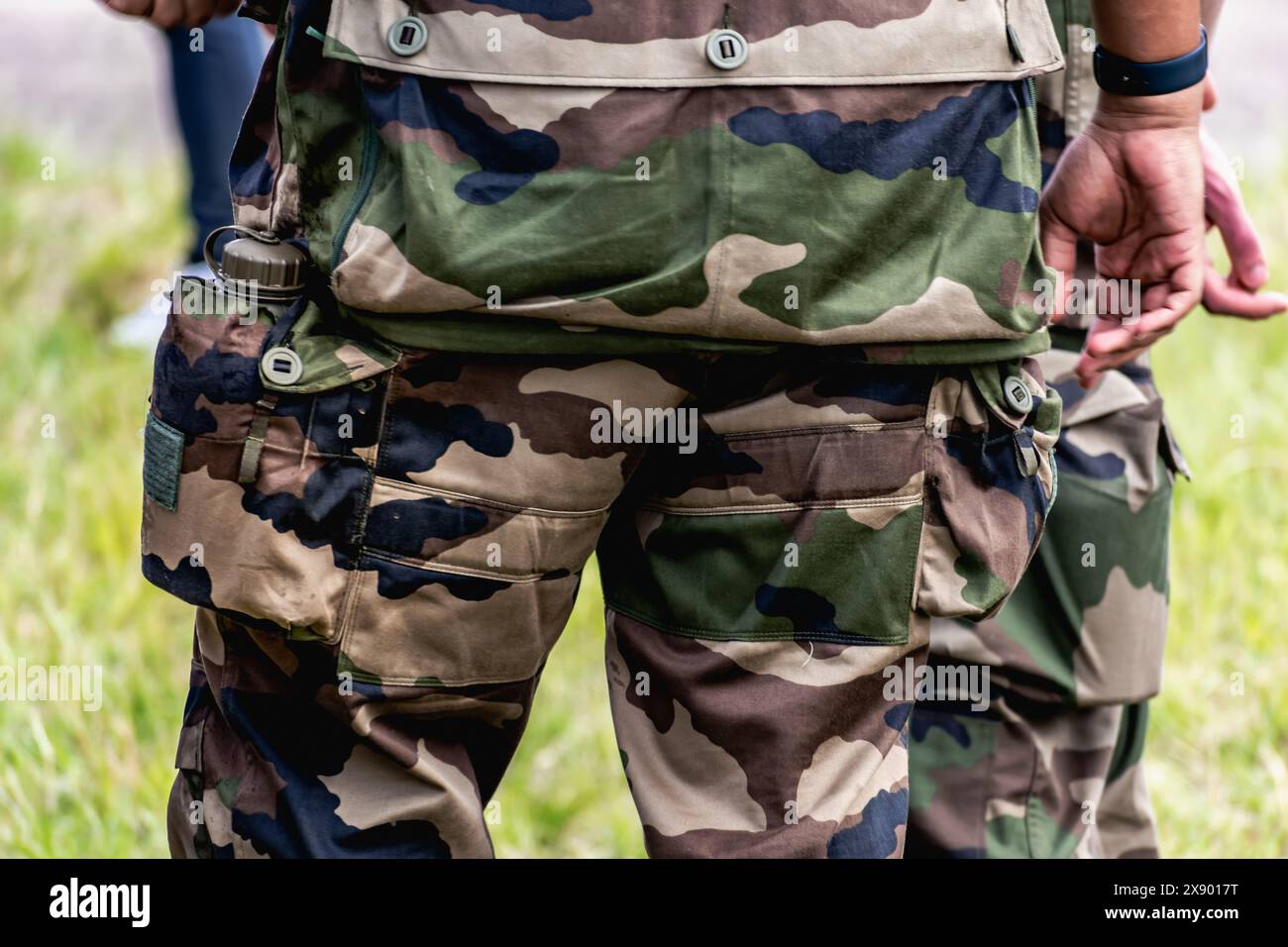 French soldier seen from behind with his equipment and camouflage ...