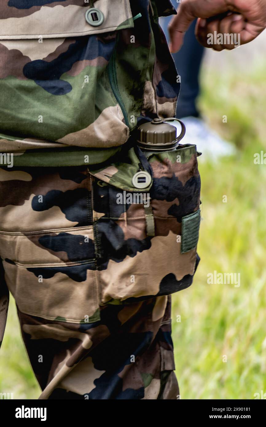 French soldier seen from behind with his equipment and camouflage ...