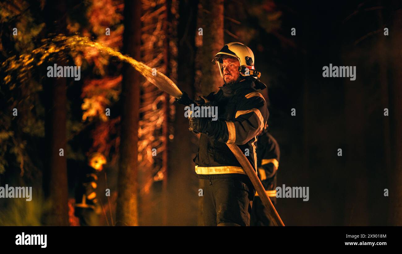 Experienced Firefighter Extinguishing a Wildland Fire Deep in a Smoke ...