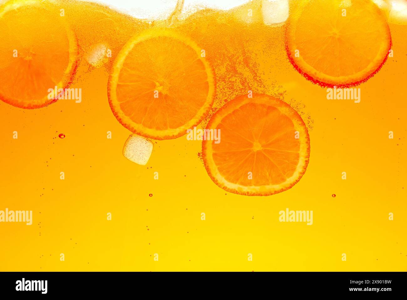 Textured photo. Playful bubbles cascade around plump orange slices in ...