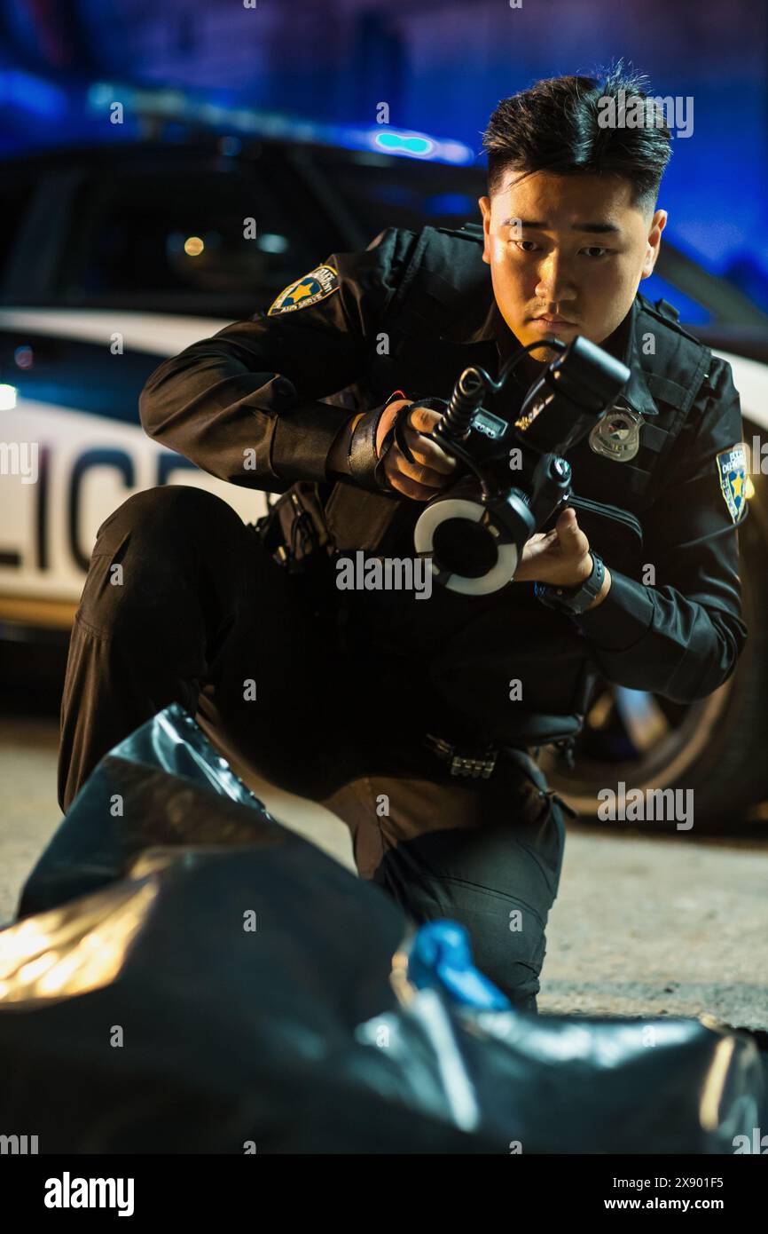 Policeman taking photograph hi-res stock photography and images - Alamy