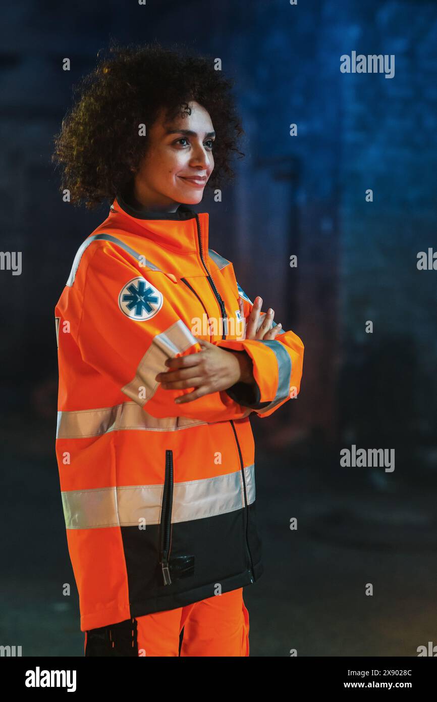 Vertical Shot: Smiling Female Paramedic Looking at Camera and Posing ...