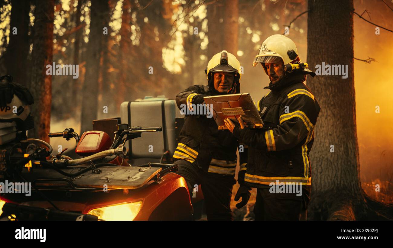 Portrait of Two Professional Firefighters Standing Next to an All ...
