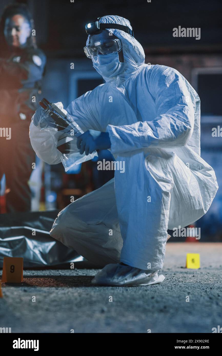 Low, Ground Level Shot: Forensics in Coverall Suit Walking Towards ...