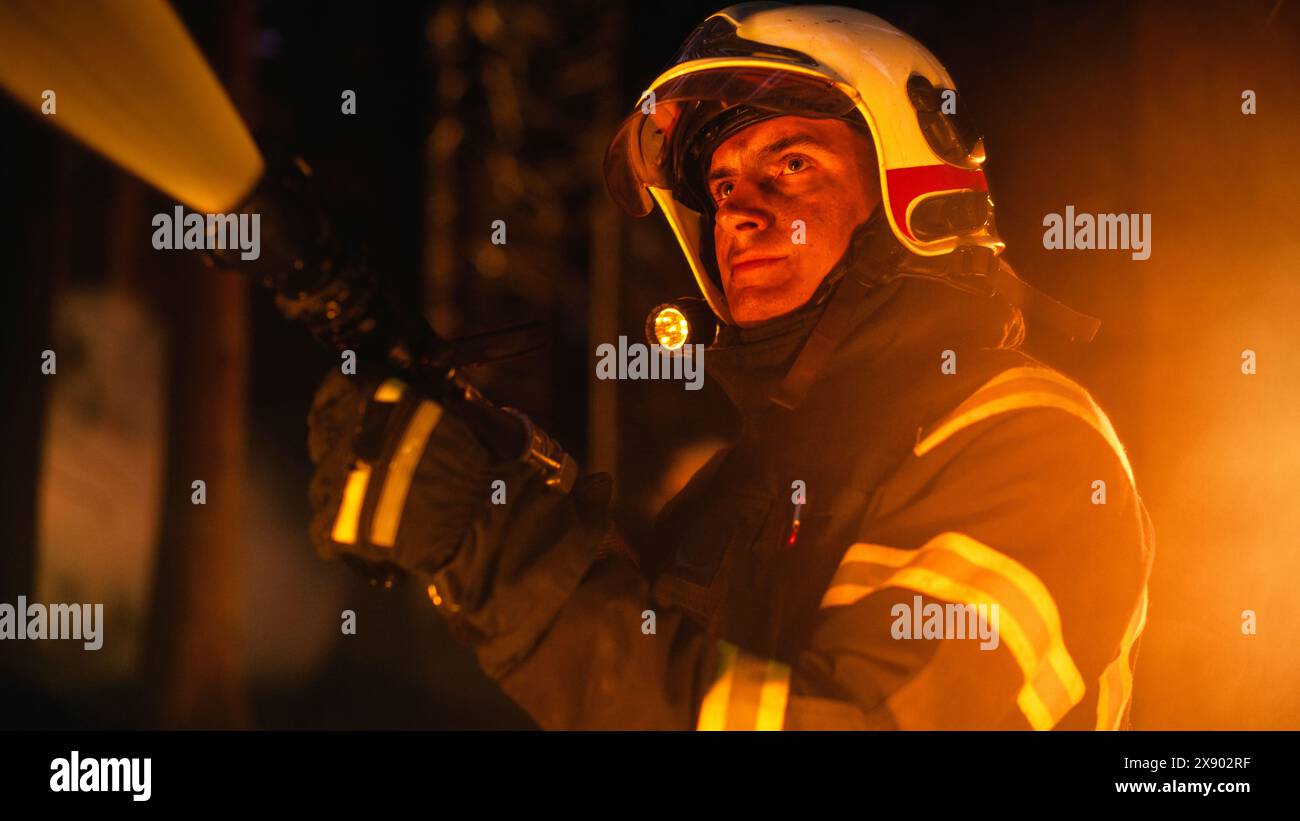 Close Up of Experienced Firefighter Extinguishing a Wildland Fire Deep ...