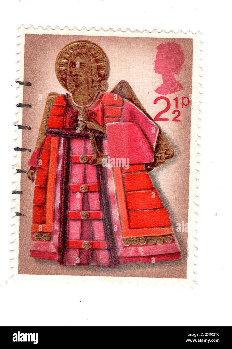 A vintage Christmas postage stamp from the United Kingdom isolated on a ...