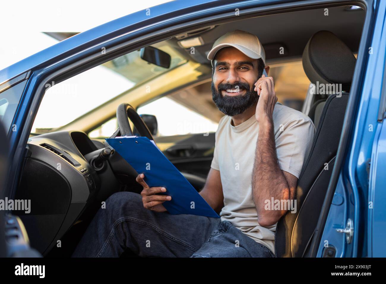 Man Sitting in Drivers Seat of Car Talking on Phone Stock Photo - Alamy