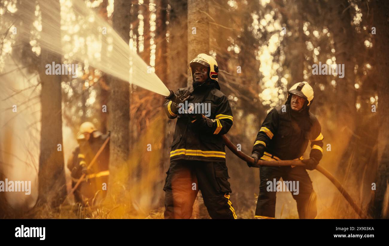 Portrait of a Brave Professional African Firefighter Using a Firehose ...