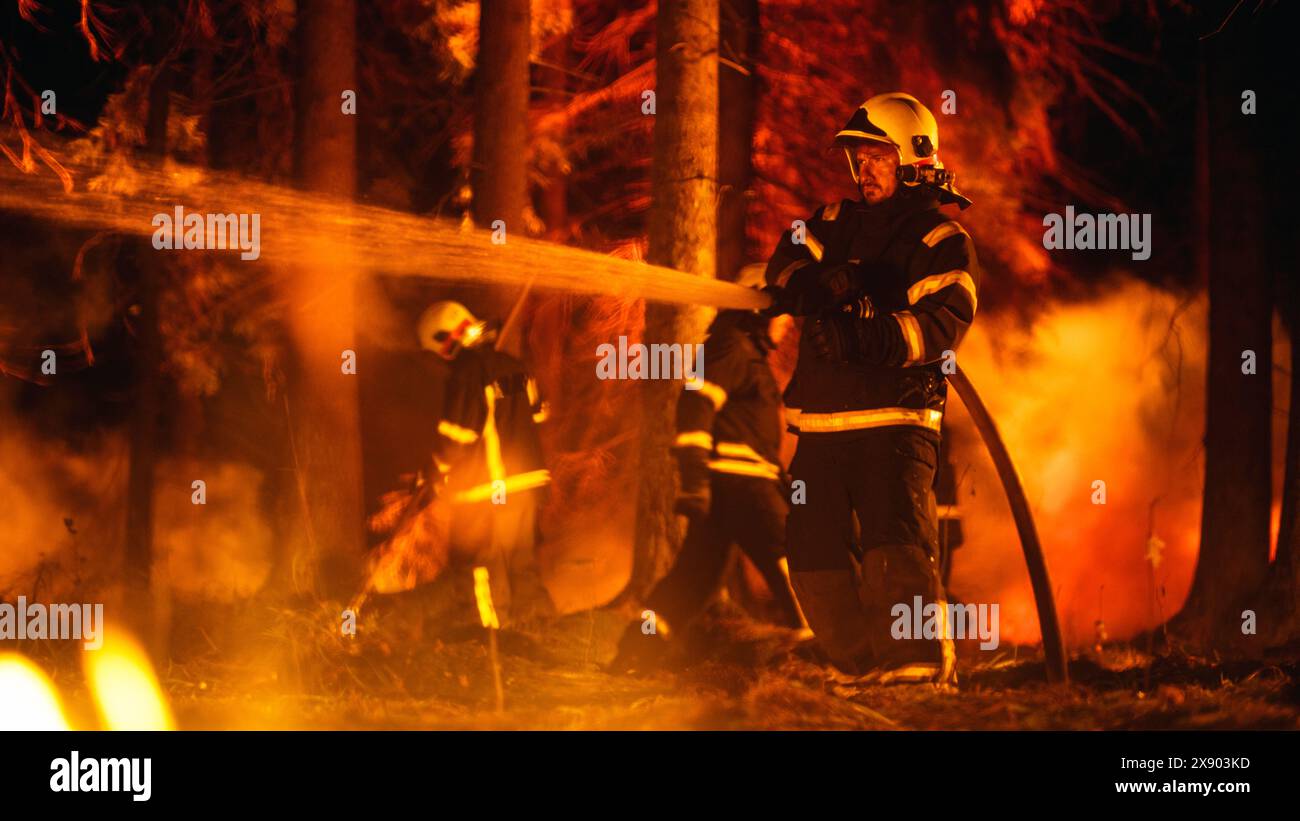 Experienced Firefighter Extinguishing a Wildland Fire Deep in a Forest ...