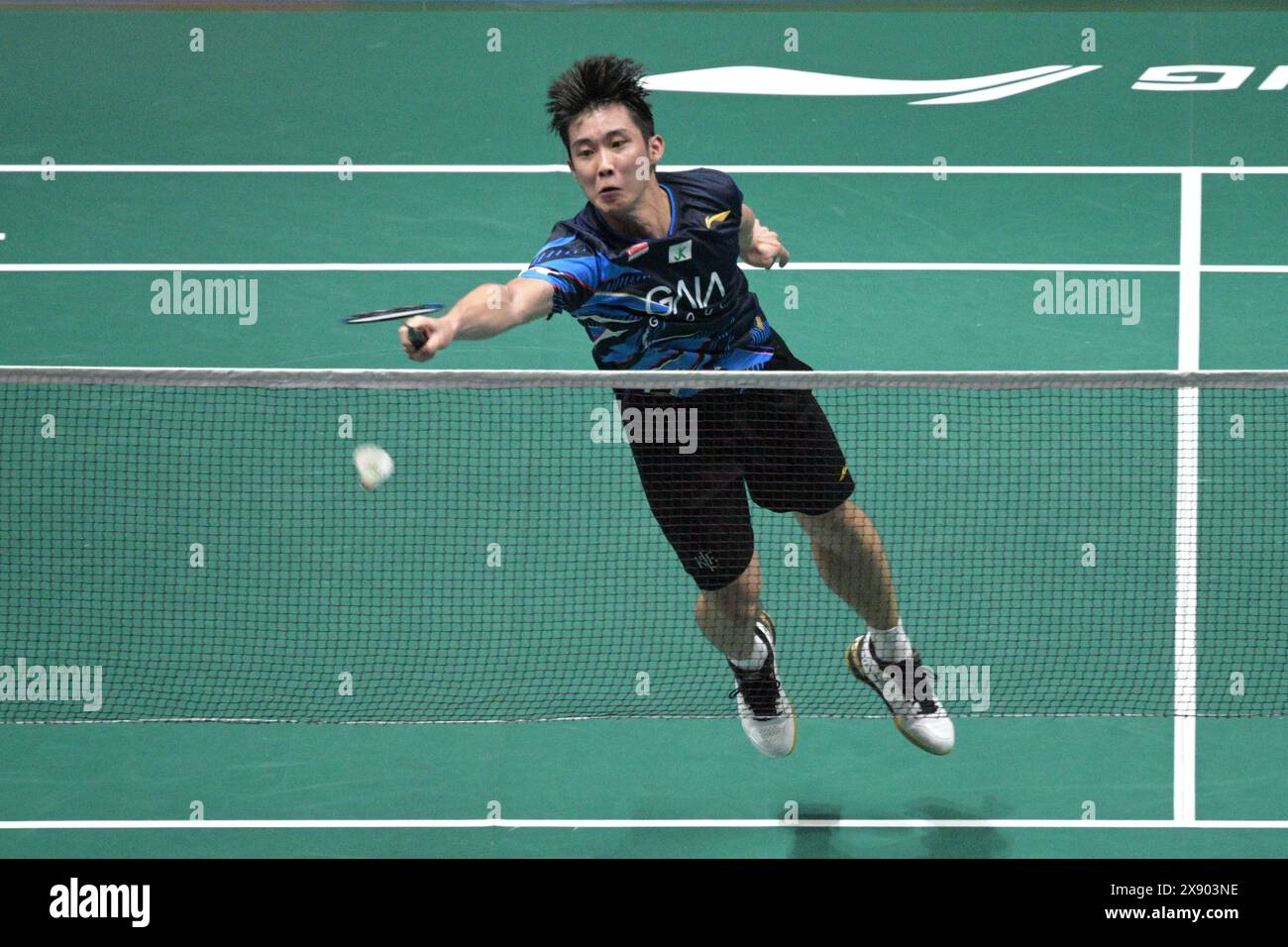 Singapore. 28th May, 2024. Loh Kean Yew of Singapore hits a return to ...