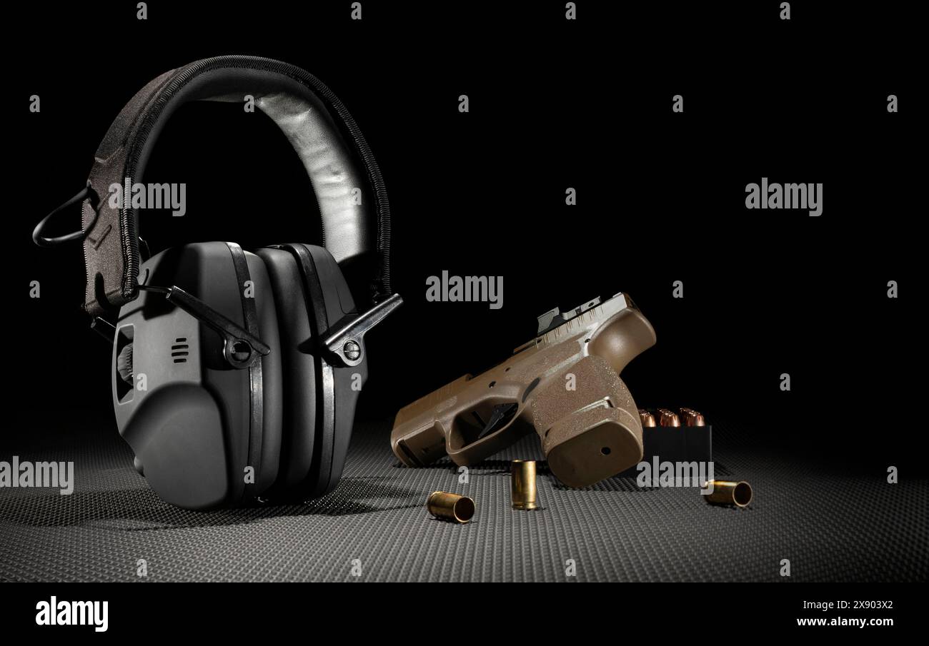 Semi automatic 8 mm handgun with electronic hearing protection with ...