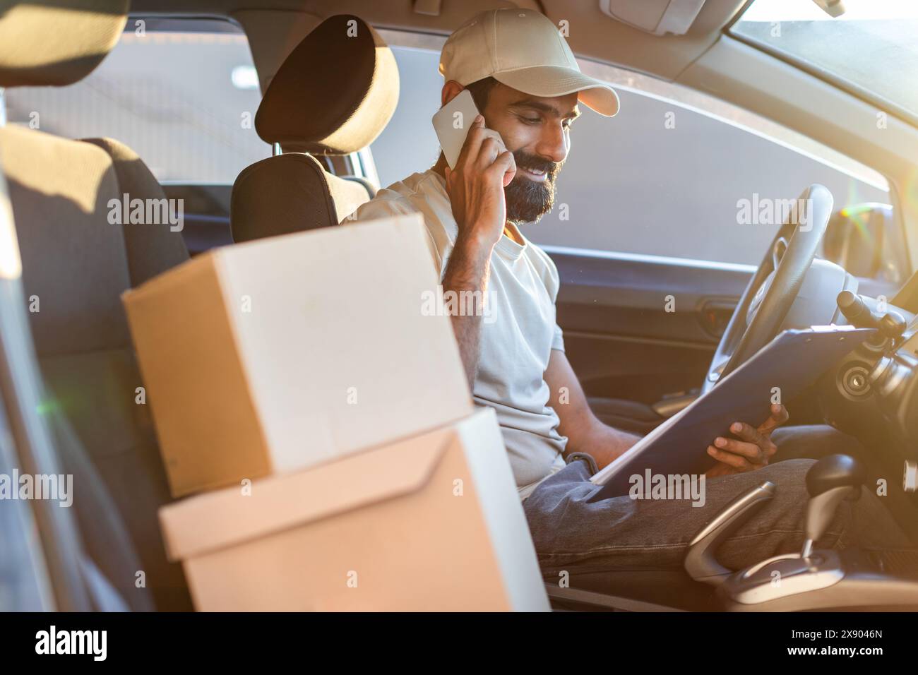 Indian delivery man talking hi-res stock photography and images - Alamy