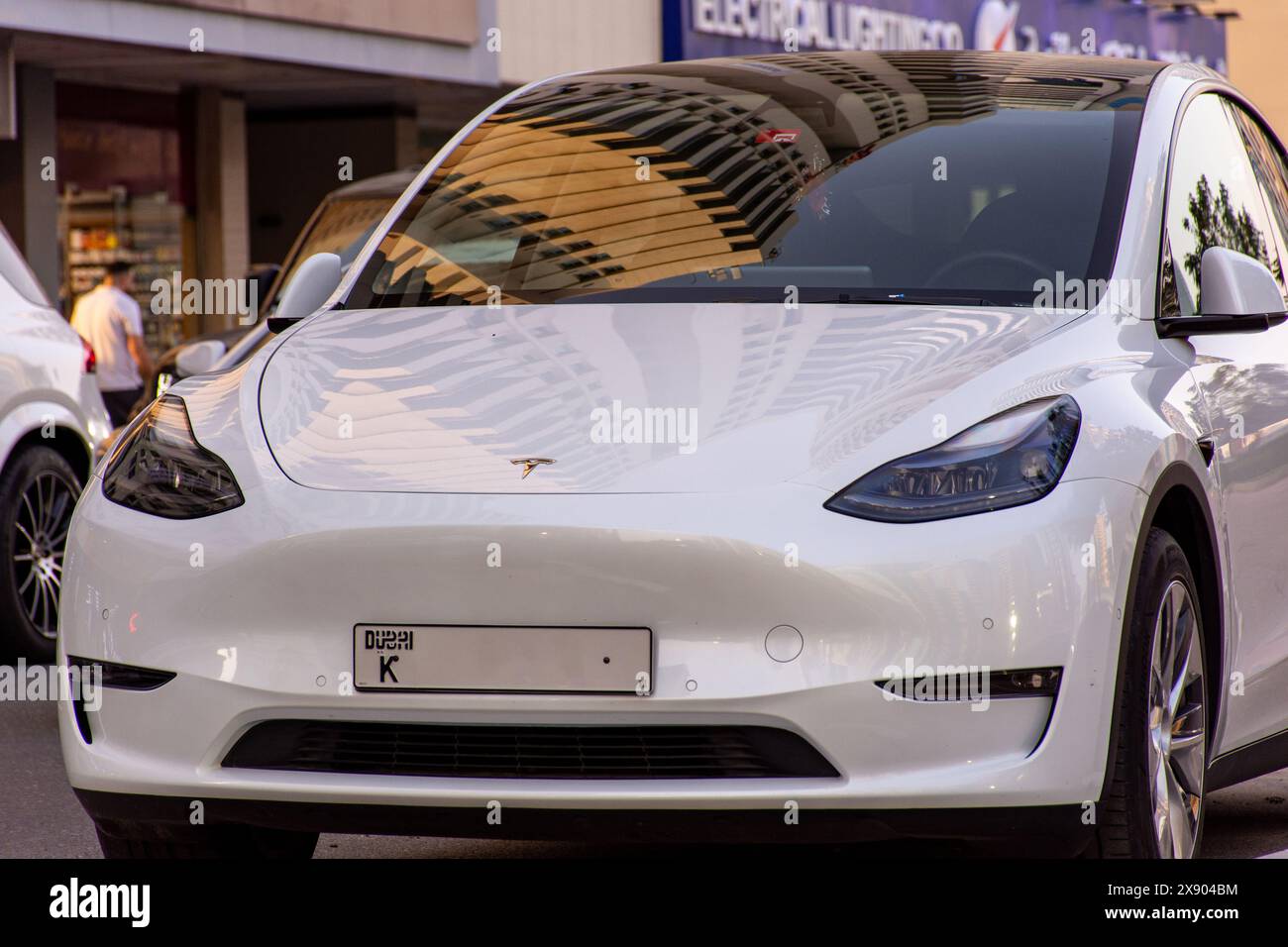 Close-up of white Tesla Model Y in the street in Dubai City. UAE Stock ...